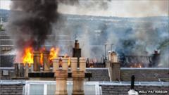 Firefighters put out blaze at historic Edinburgh flats - BBC News