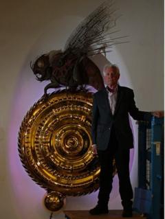 'Time-eater' clock on display at Saatchi Gallery - BBC News