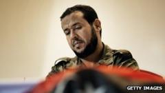 Libya's Belhadj quits military post for politics - BBC News