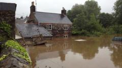 Devon severe flood warning stood down - BBC News