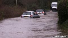 Wallington evacuated in flood fear as heavy rain hits England - BBC News