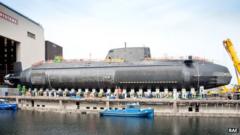 Third Astute submarine Artful enters water at Barrow - BBC News