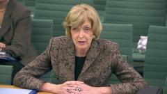 Abuse inquiry: Fiona Woolf steps down as chairwoman - BBC News