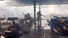 Bilston fire: Crews tackle Oxford Street blaze - BBC News