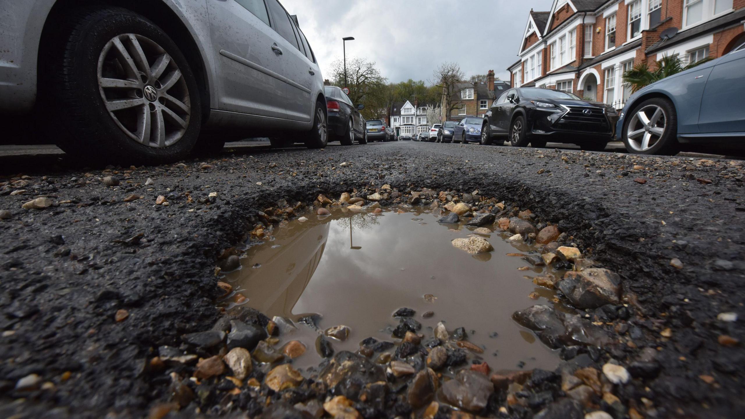 No quick fix for London's potholed roads, industry report warns - BBC News