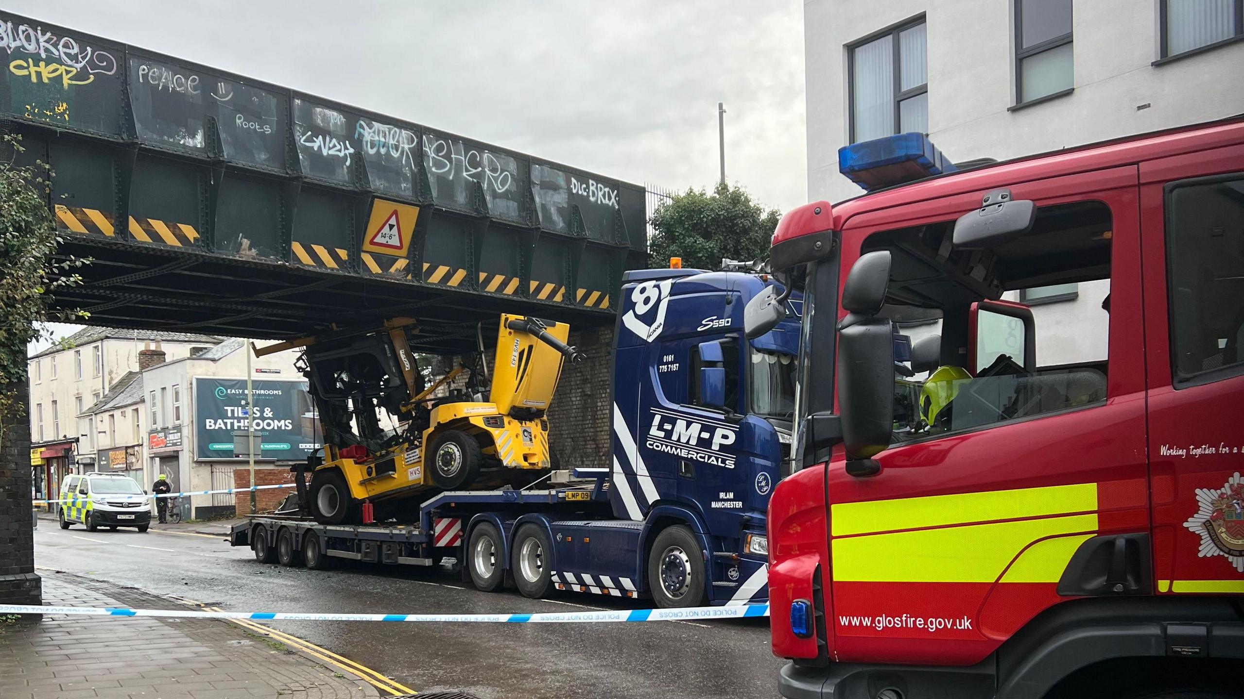 Lorry stuck under bridge causes Cheltenham traffic disruption - BBC News