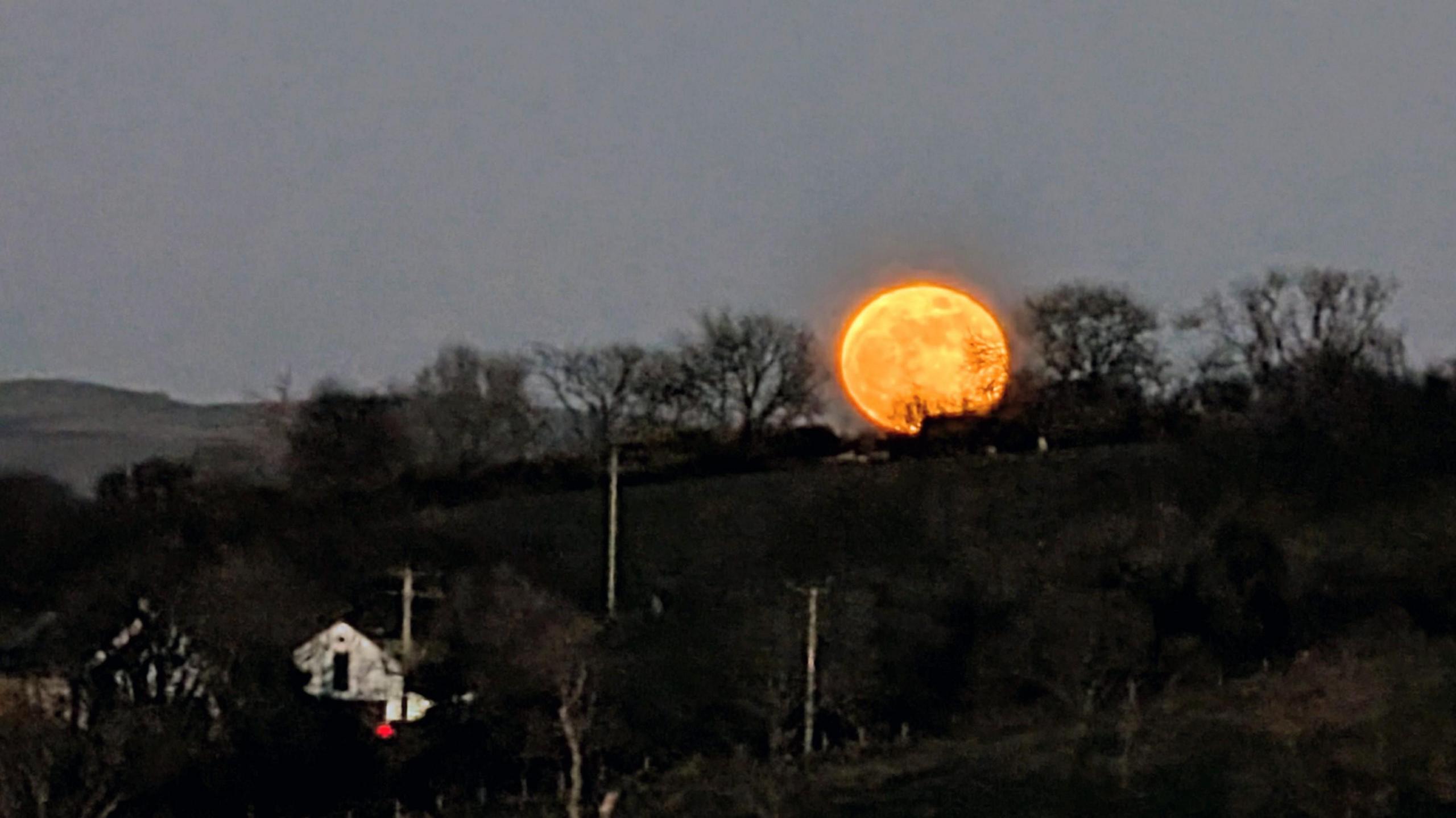 Worm Moon captured over Northern Ireland - BBC News