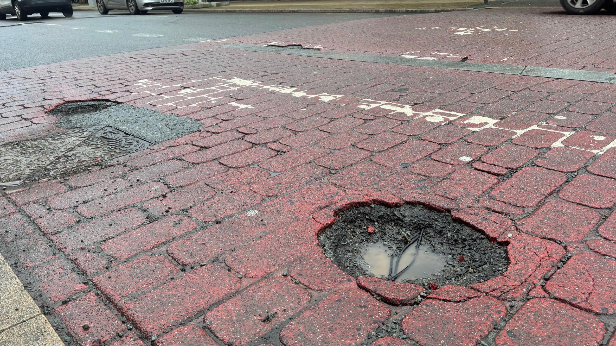 What is behind the spike in pothole related call-outs? - BBC News