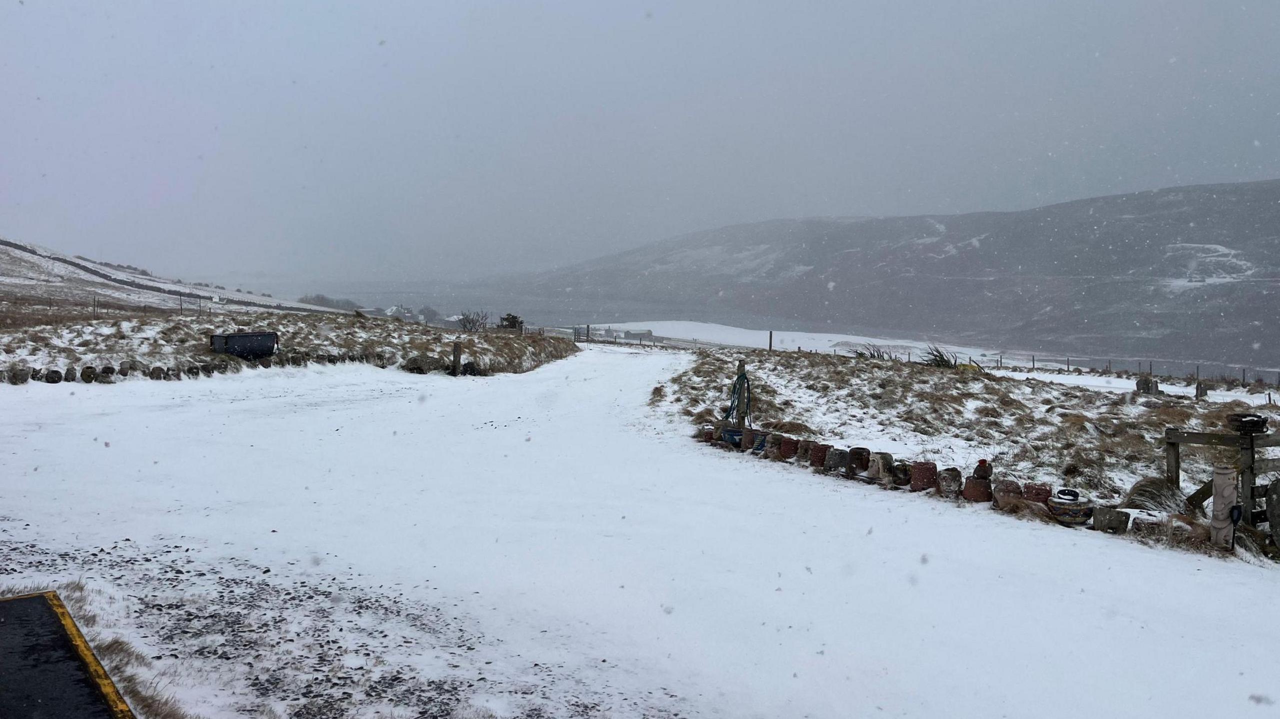 Snow hits parts of Scotland during weather warnings - BBC News