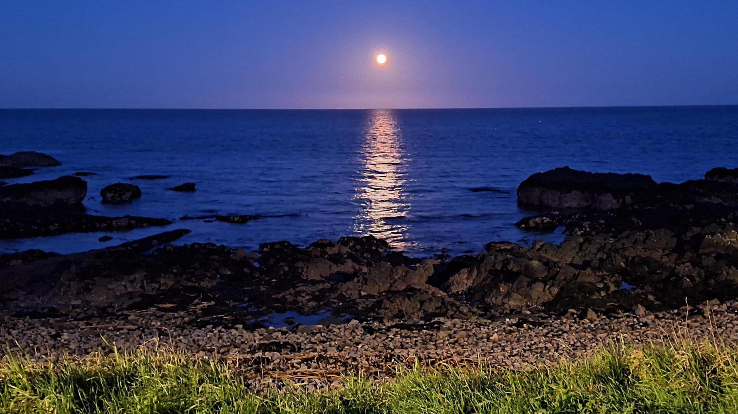 Worm Moon captured over Northern Ireland - BBC News