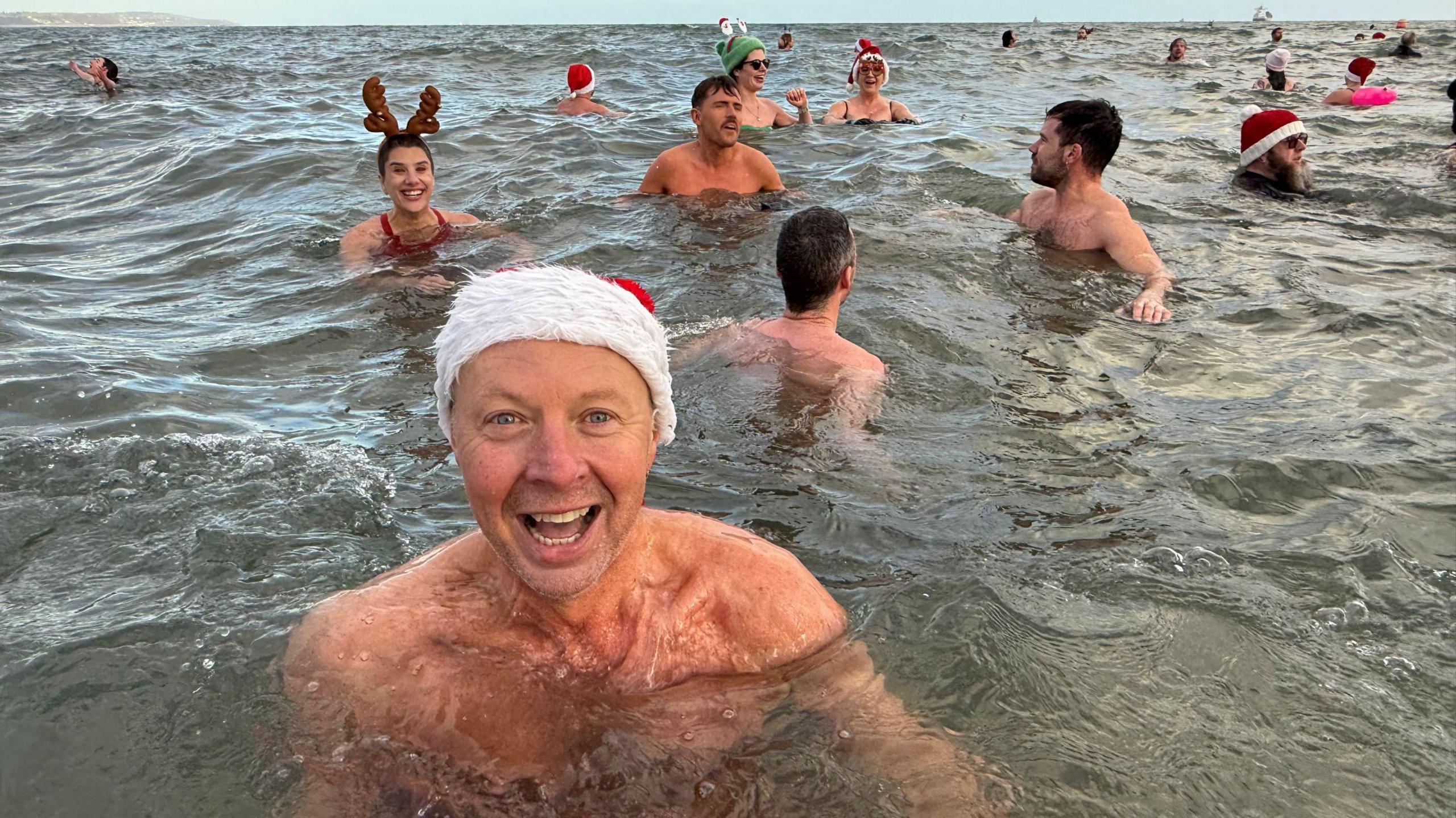 In pictures: Helen's Bay Christmas Eve swim - BBC News