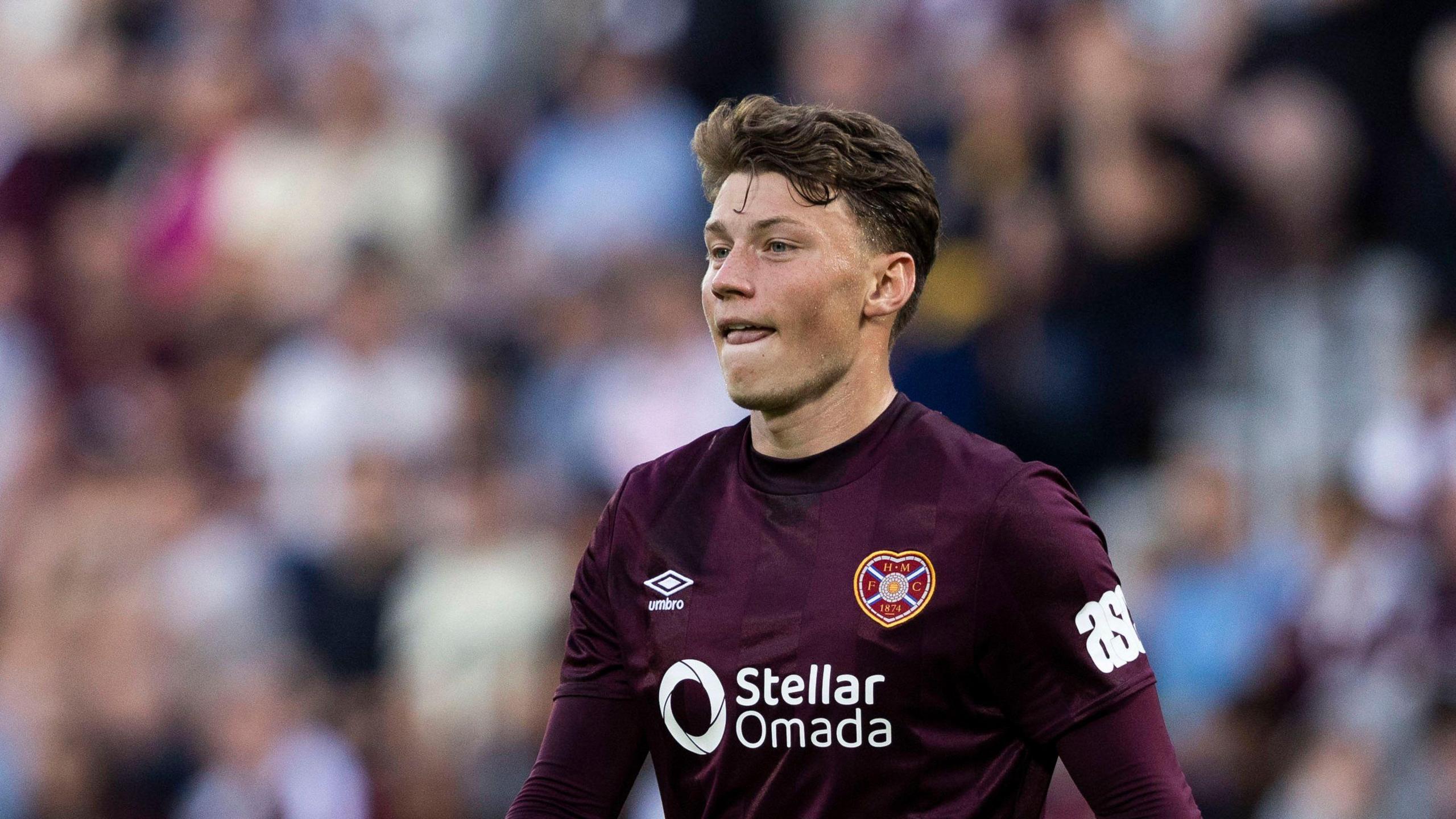 Midfielder Denholm joins from Hearts on loan - BBC Sport