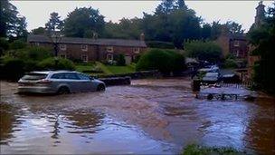 Great Corby bridge collapses in flash floods - BBC News