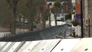 Ironbridge flood defences to remain for a few more days - BBC News