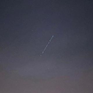 Elon Musk's Starlink satellites light up sky in south of England - BBC News