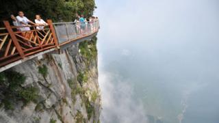 Glass bridge: China opens world's highest and longest - BBC News