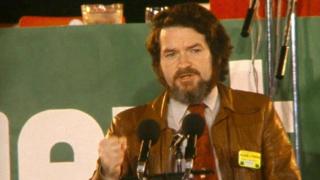 Dafydd Iwan praises Kneecap as the veteran singer bows out - BBC News