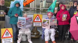 Extinction Rebellion activists stage Thames Water toilet protest - BBC News