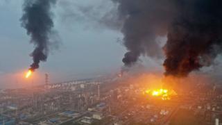 China fire: Skyscraper engulfed in massive flames - BBC News