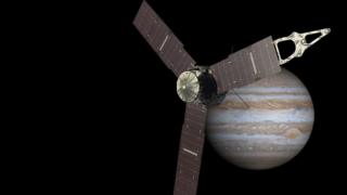 Io volcano world comes into view of Juno probe - BBC News