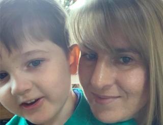 Coronavirus: Boy yearns to see seaman dad moored outside house - BBC News