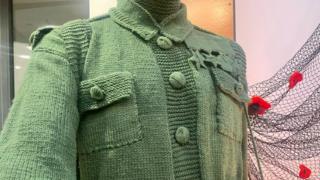 Life-sized remembrance soldier created by knitters - BBC News