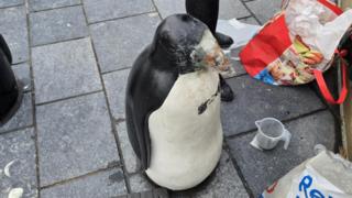 Redcar's damaged penguin statue repaired by resident - BBC News