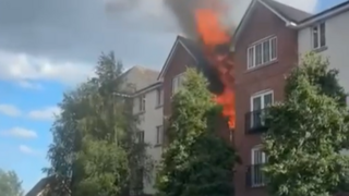 Warrington flats fire sees 50 people rescued from blaze - BBC News