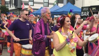 Suffolk Pride returns with parade through Ipswich - BBC News