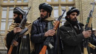 The Afghan district stuck between IS and the Taliban - BBC News