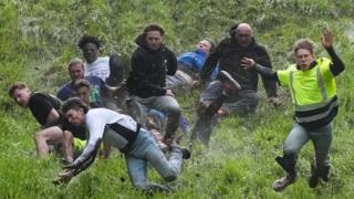 Gloucestershire cheese rolling: Tom Kopke wins again - BBC News