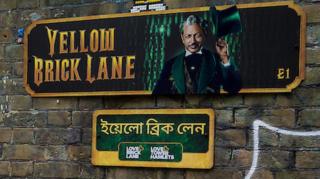 Brick Lane painted yellow to celebrate release of new Wicked film - BBC ...