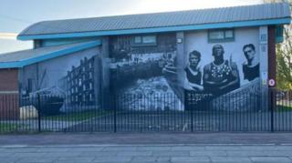 James Clarke: Liverpool mural for swimming hero who saved dozens - BBC News