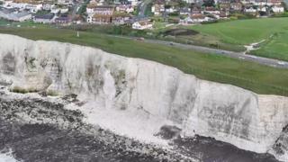 East Sussex: Alert after cliff collapse caught on camera - BBC News