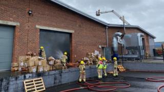 Andover: Crews remain at furniture warehouse fire - BBC News