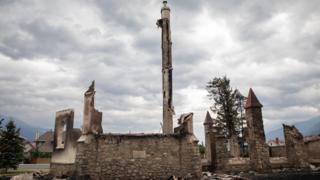 Jasper fire: Images show destruction from wildfire in Canada - BBC News