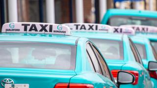 Use licensed taxis on New Year's Eve, Guildford council says - BBC News