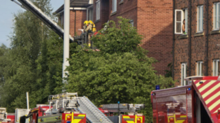 Warrington flats fire sees 50 people rescued from blaze - BBC News