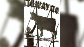 Derby's symbolic 'Co-op cow' sign to light up again - BBC News