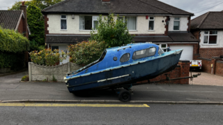 Search for owner of boat left on Stoke-on-Trent street - BBC News