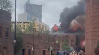 Manchester fire: People evacuated from tower after blaze spreads - BBC News