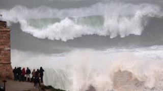Spain search as storm sweeps three family members into sea - BBC News