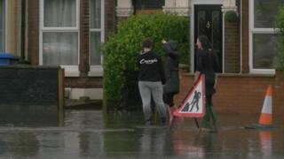 Heavy rain causes flash flooding in Norwich - BBC News