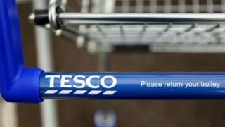 Tesco posts record £6.4bn annual loss - BBC News