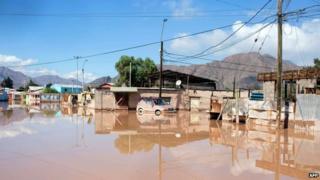 Chile floods death toll rises to 17 as clean-up begins - BBC News