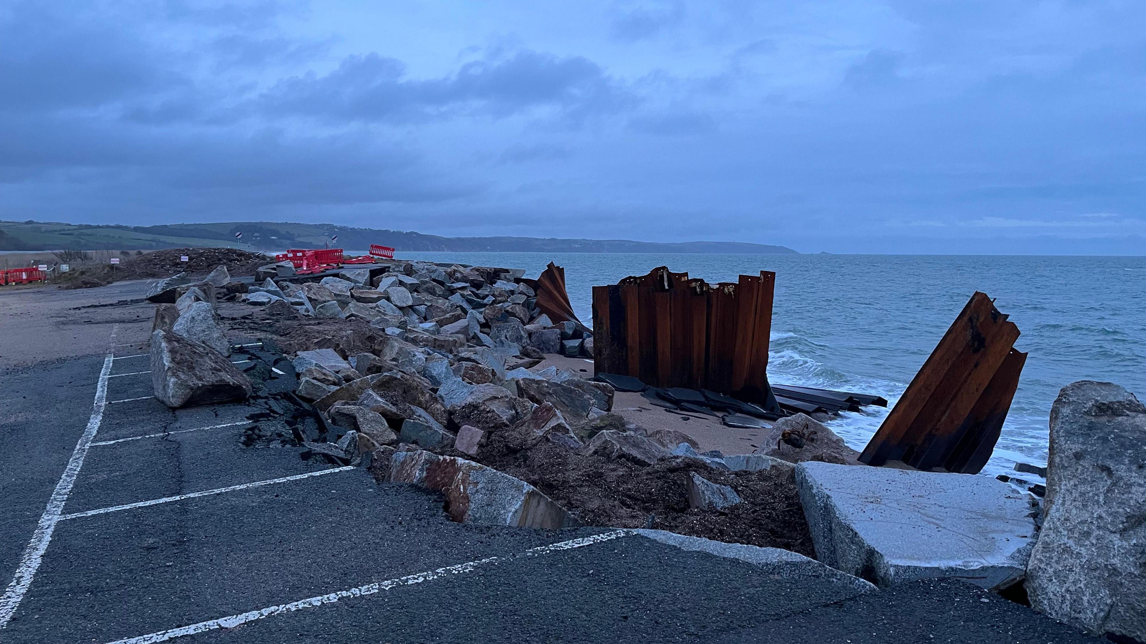 Collapsed coastal road in Torcross is 'catastrophic' to village - BBC News