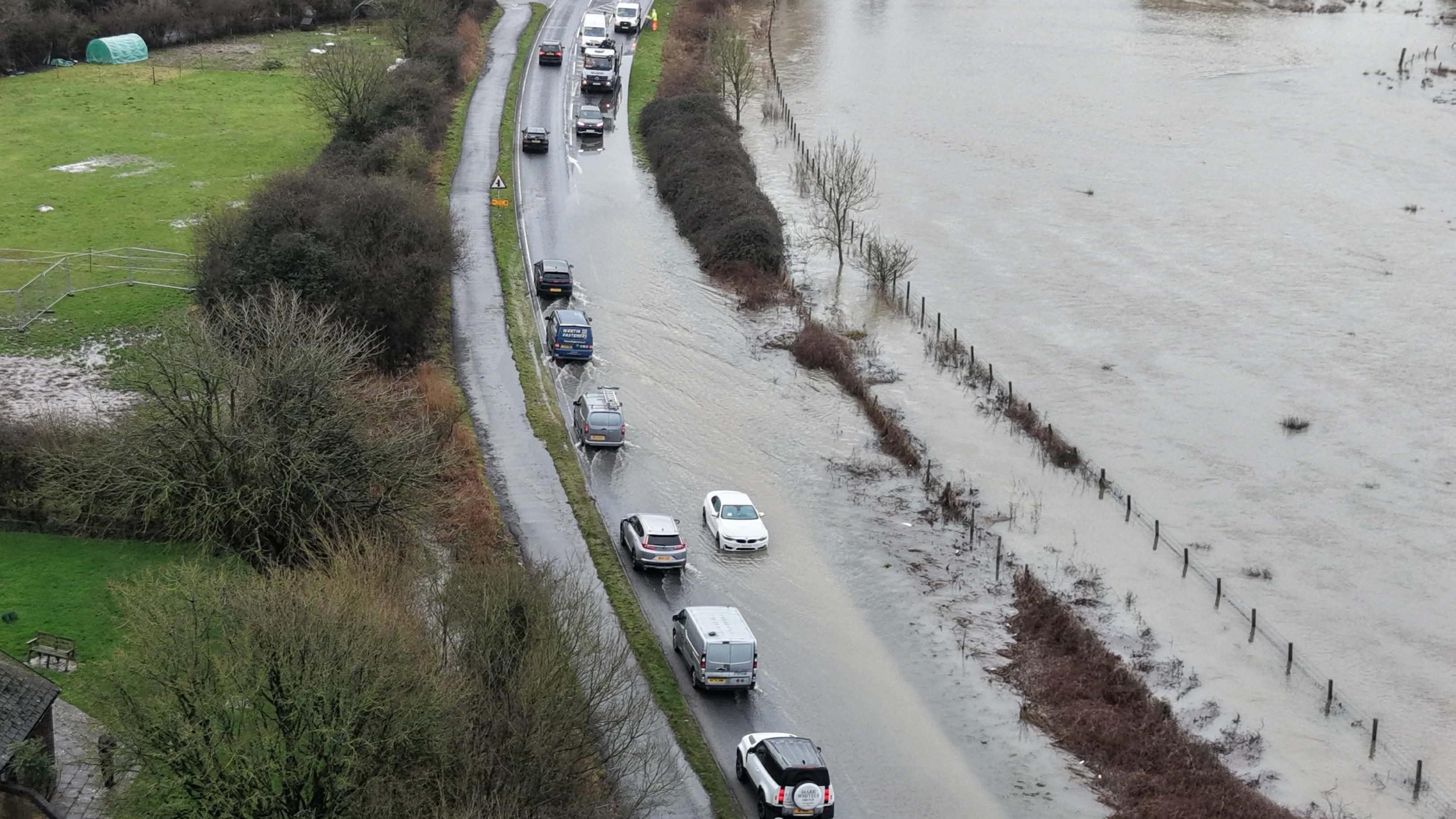 Charminster drone photos show impact of Storm Chandra flooding - BBC News