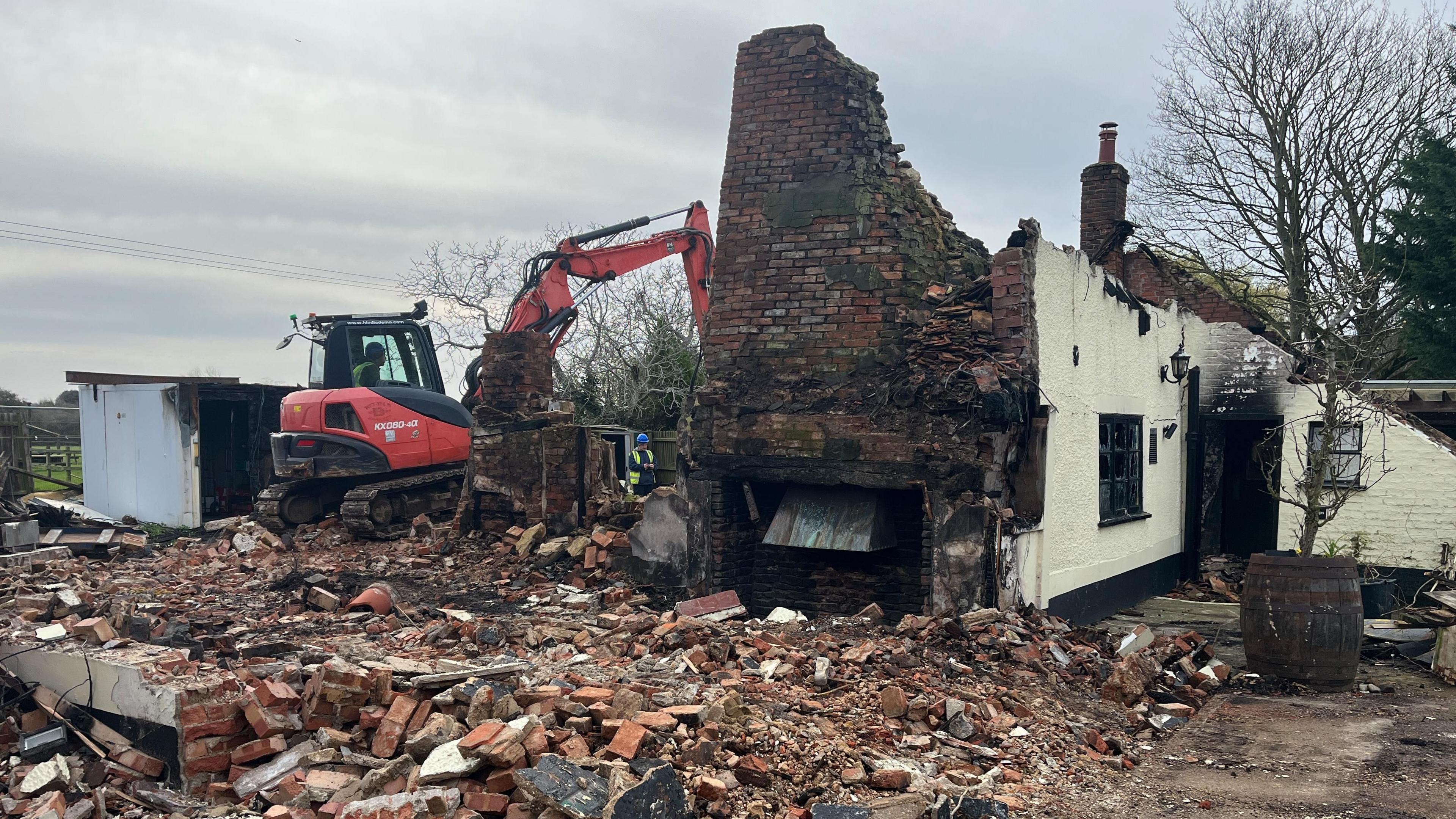 Work begins to demolish 17th Century fire-ravaged pub near Bedford ...