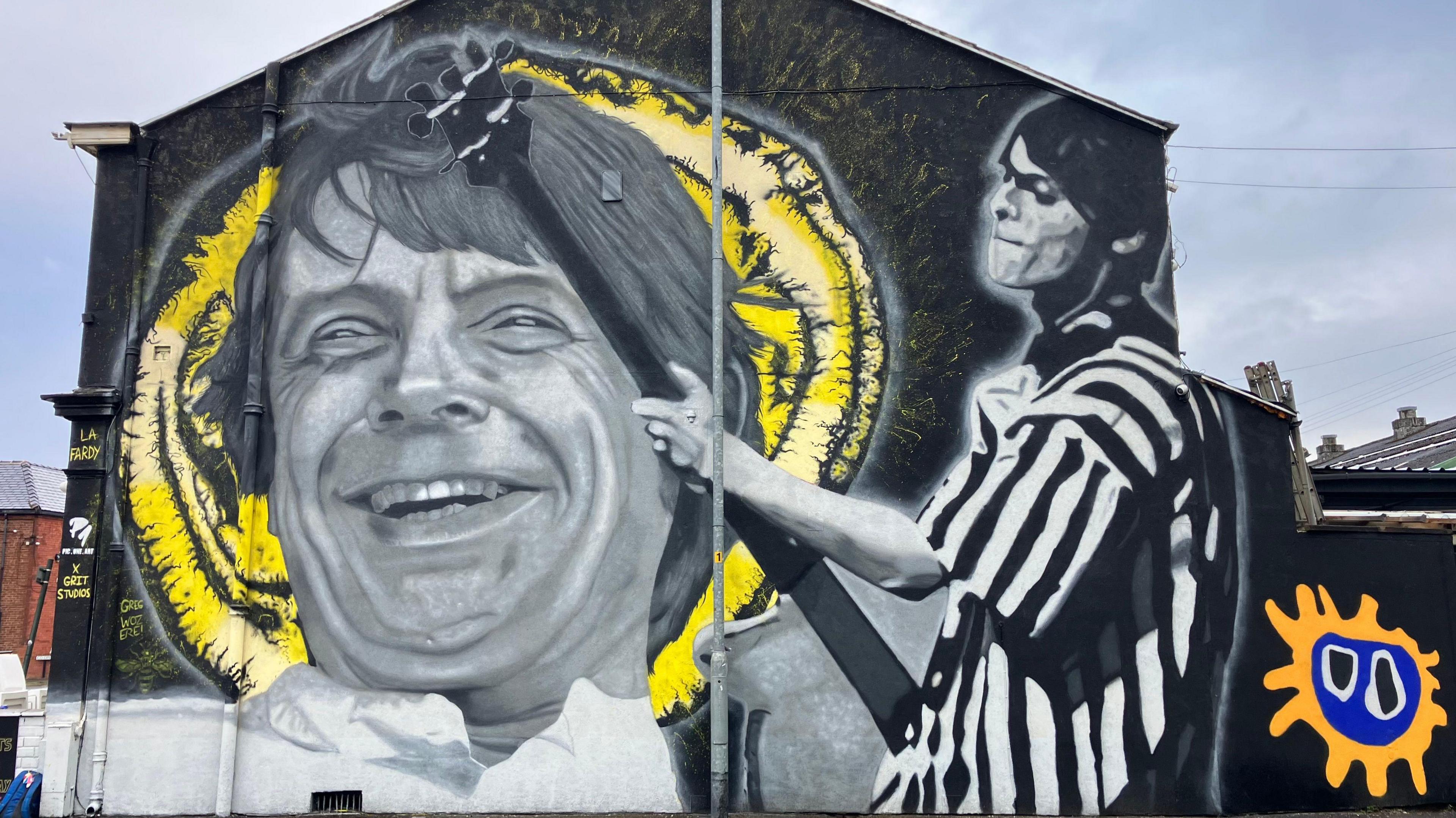 Mural tribute to Stone Roses and Primal Scream's Mani unveiled - BBC News