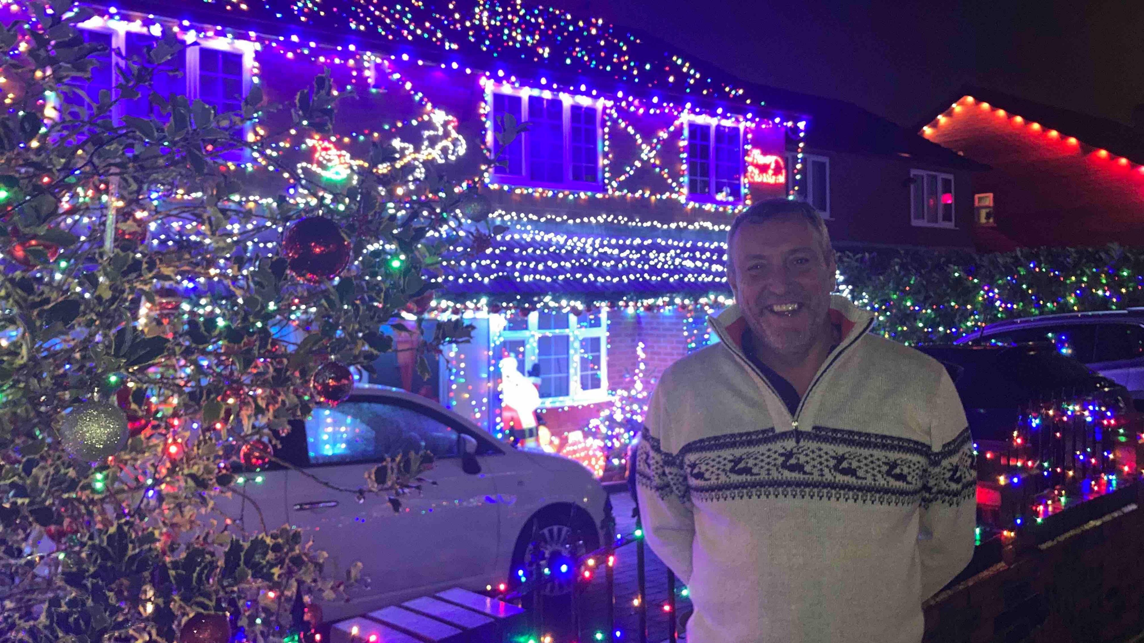 Neighbours raise £20k for Dougie Mac hospice with lights display - BBC News
